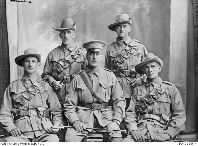 Outdoor portrait of five unidentified members of the AIF who enlisted ...