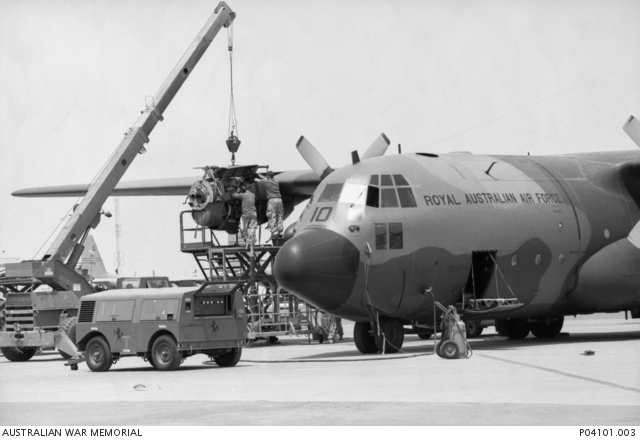 Two ground crew members from 36 Squadron RAAF complete maintenance on ...