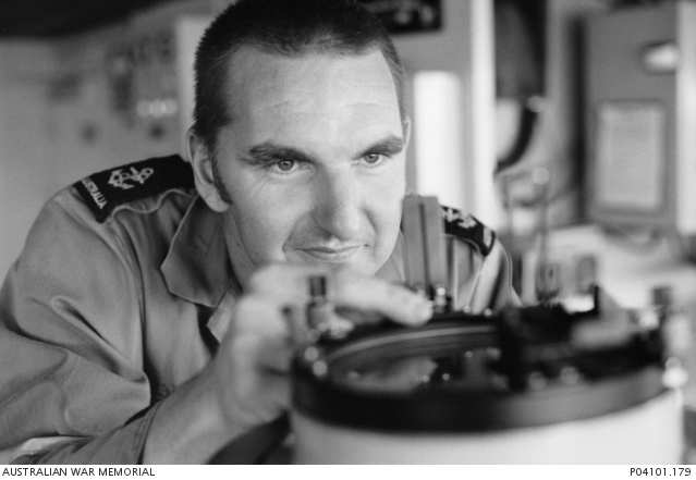 Leading Seaman Jeff Simes checks the direction of the swell while ...