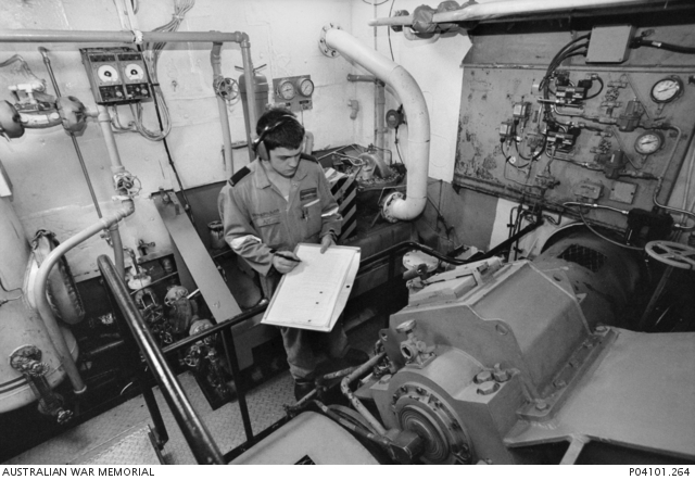 Seaman (SMN) Jason Papadopoulos monitors the equipment in the engine ...