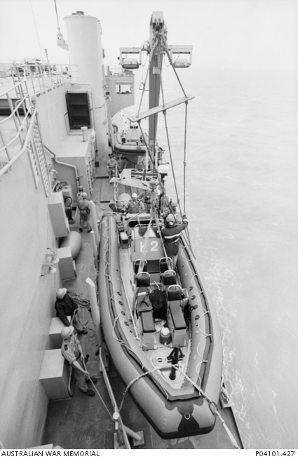 A Rigid-Hulled Inflatable Boat (RHIB) is lowered into the Khawr Abd ...