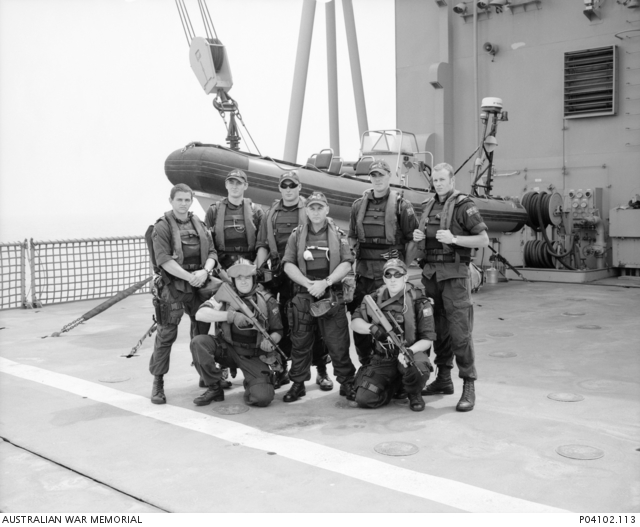 Informal group portrait of an HMAS Kanimbla boarding party. Boarding ...
