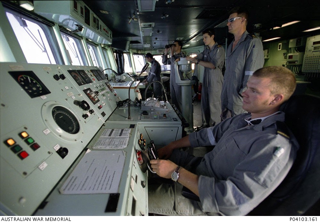Unidentified officers work on the bridge of HMAS Anzac, while on ...