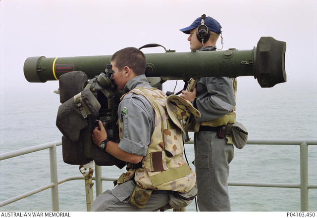 Two unidentified crew members of HMAS Kanimbla operate an RBS-70 ...