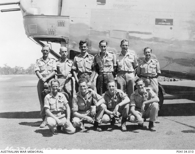 Group portrait of RAAF aircrew standing in front of their B-24 J ...
