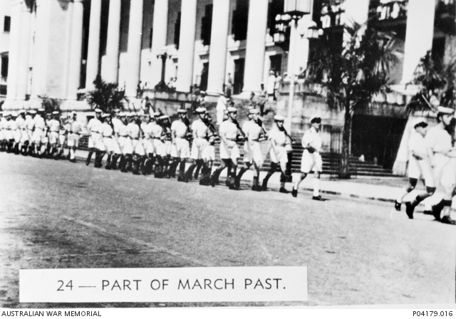Allied sailors and soldiers march in the parade following the ceremony ...