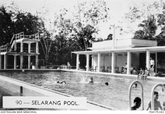 People enjoying a swim in Selarang swimming pool. | Australian War Memorial