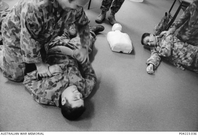 Defence personnel practice first aid techniques during a pre-deployment ...