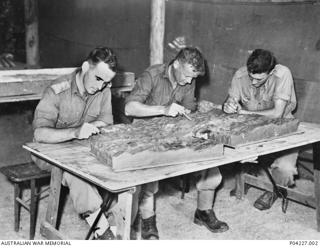 Three unidentified members of the Central Interpretation Unit AIF ...