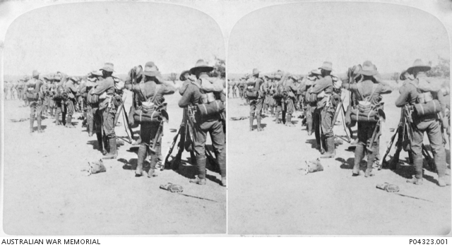 Australian troops removing their equipment as they prepare to take a ...