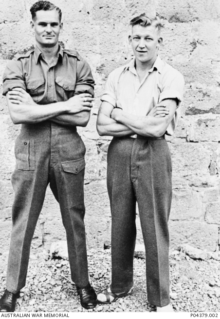 Informal portrait of two Australian Prisoners of War (PoW). On the left ...