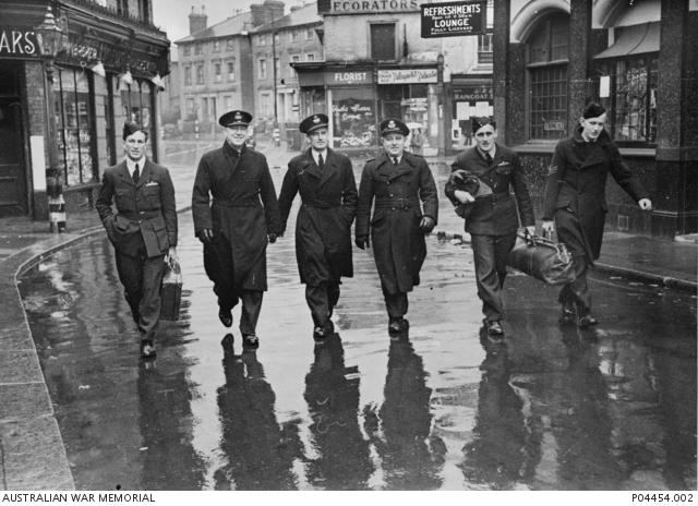 Informal portrait of six members of the RAAF on their way to a rugby ...