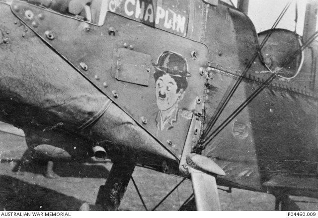 Port side view of a British BE2 aircraft displaying nose art of a head ...