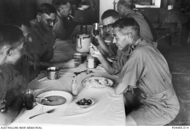 Unidentified Allied Prisoners of War (POW) having a meal in the ...