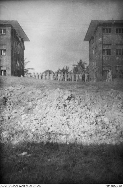 Unidentified Allied Prisoners of War (POWs) lined up in between two of ...