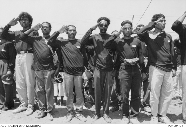 Members of the Aitarak pro-Indonesian militia salute during the funeral ...