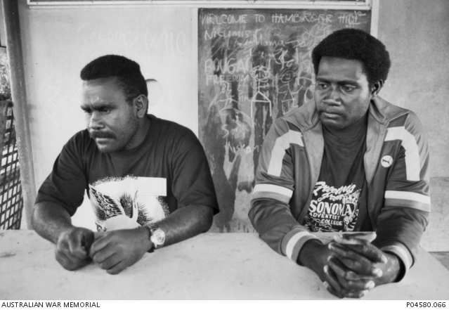Two members of the Bougainville Resistance Force (BRF) nervously await ...
