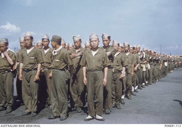 South Korean Service Corps workers forming up in ranks and files. Some ...