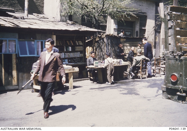 A bookseller operating a footpath stall. One of a series of photographs ...