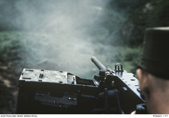 A .5 inch (50 calibre) machine gun firing from a US armoured vehicle ...