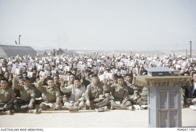 Several hundred North Korean or Chinese prisoners of war (POWs) holding ...