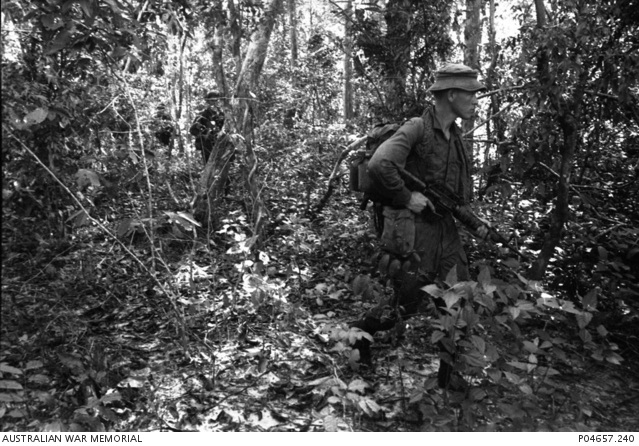 With his finger on the trigger of his L1A1 Self Loading Rifle (SLR), an ...