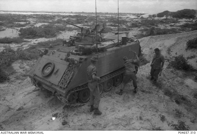 Near Night Defensive Position (NDP) Brigid, a crew member of an M113A1 ...