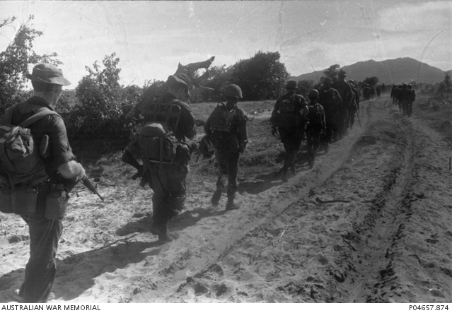 Wearing floppy bush hats, members of D Company, 6RAR/NZ (ANZAC ...