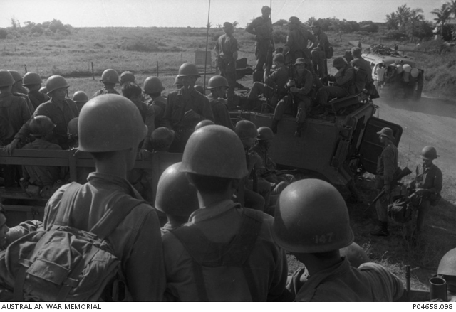 An Armoured Personnel Carrier (APC) carrying members of D Company, 6RAR ...