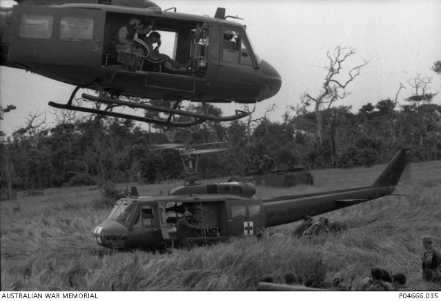 A medical evacuation helicopter from No. 9 Squadron RAAF (top) has just ...