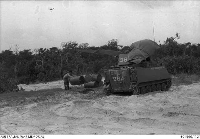 An M113A1 Repair Fitters Vehicle from 3 Cavalry Regiment uses its HIAB ...