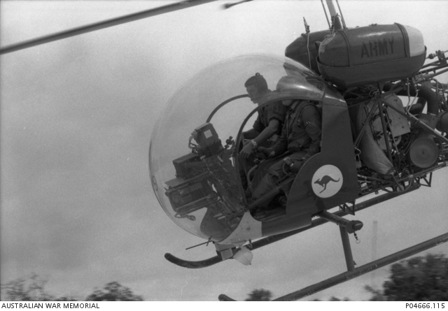 Close-up view of the crew in the cockpit of Bell OH-13 Sioux ('Possum ...