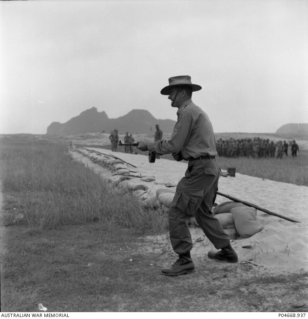 35461 Warrant Officer 2 (WO2) Keith Owen (Windy) Winbank stands and ...