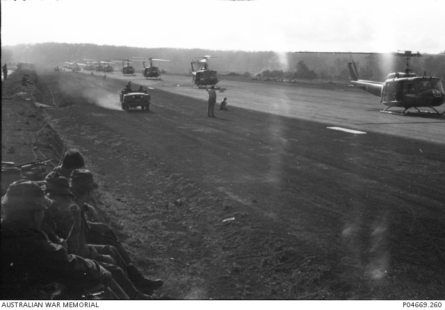 RAAF UH-1 Iroquois ('Huey') helicopters stand in a long line on the ...