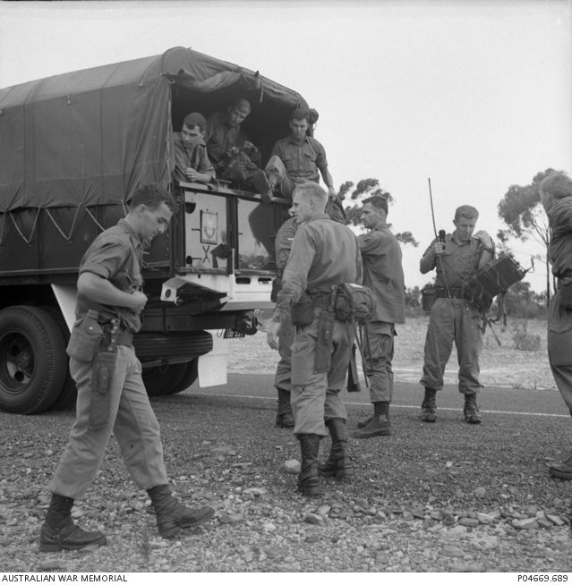 Recent recruits to the infantry gather at the back of an Army truck at ...