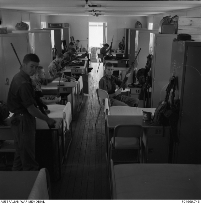 Infantry Corps trainees clean their rifles inside their barracks at the ...