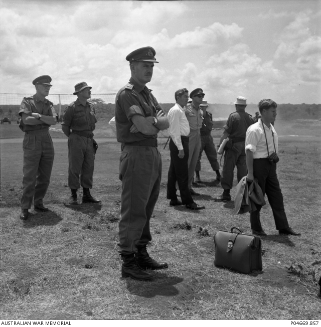 At the 1st Australian Task Force (1ATF) base, a group of officers and ...