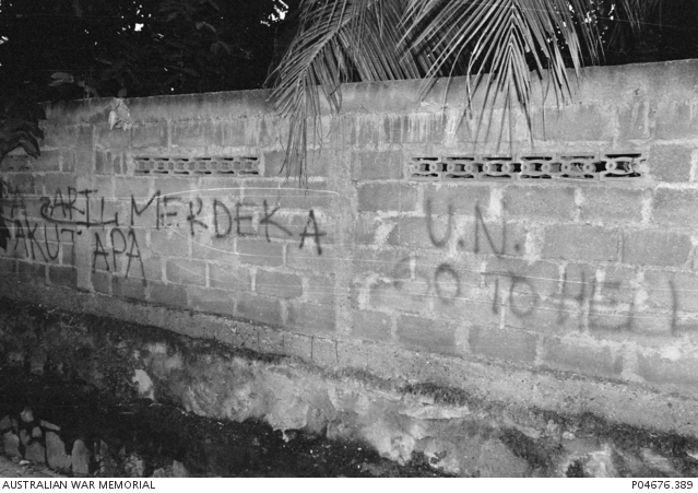 Graffiti on a wall at Santa Cruz road reads, 'ART (or ARTI) MERDEKA ...