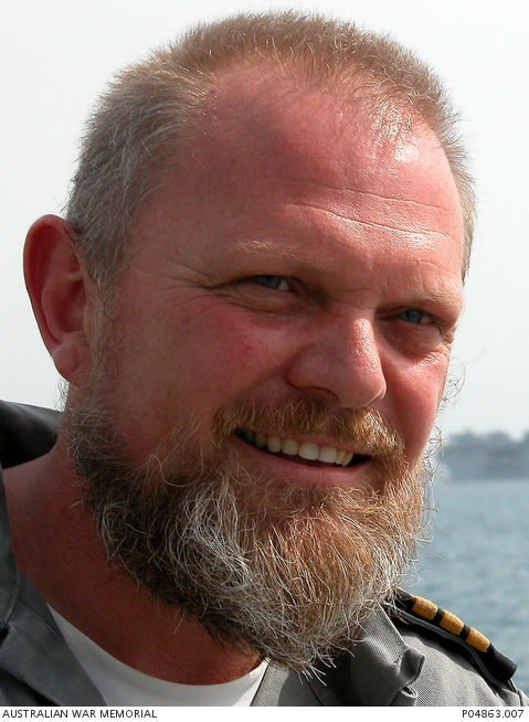 Informal portrait of Commander Stuart Wheeler, RAN aboard HMAS Anzac ...