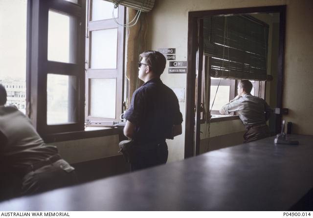 Three unidentified RAAF men in the Free World Building. A43255 Sergeant ...
