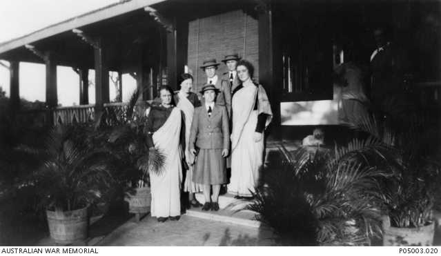 Informal group portrait of nurses and local women wearing saris on the ...