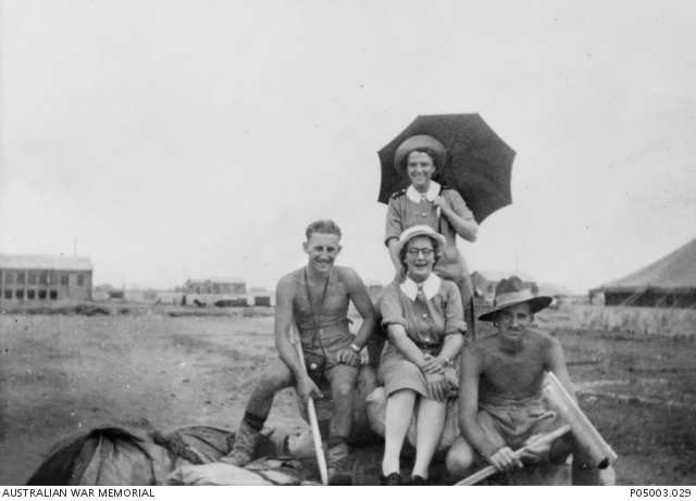Informal group portrait of nurses and servicemen at Buseili. Identified ...