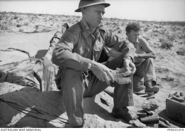Two unidentified Australian signallers from the 6th Division, having a ...