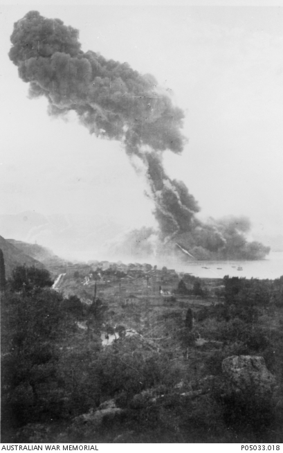 A massive plume of smoke and debris rises into the air, as a British ...