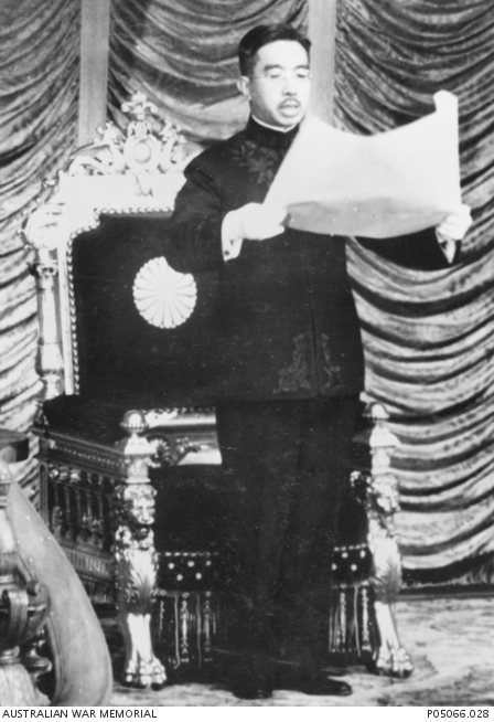 The reading of the new constitution. The Emperor, Hirohito, stands ...