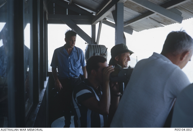 Four members of the Royal Australian Army Medical Corps (RAAMC) keep a ...