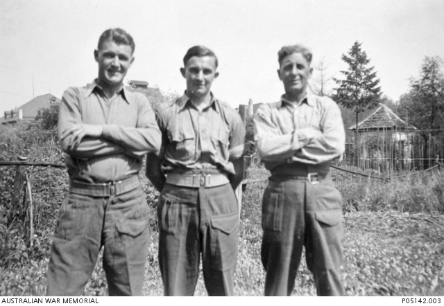 Informal group portrait of three brothers. Identified from left to ...