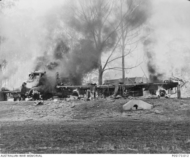 The burning wreckage of a truck that was accidentally exploded at St ...