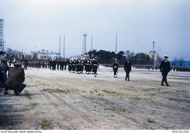 Members of the RAN and Australian Army march past at a British ...