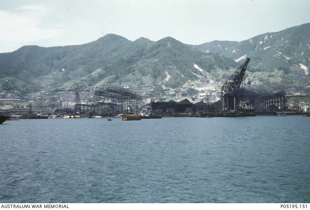 View from the harbour of the ruins of the Kure docks, which were ...
